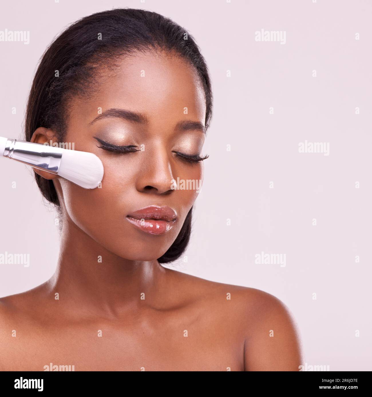 Cosmetics, makeup brush and black woman with mockup in studio with ...