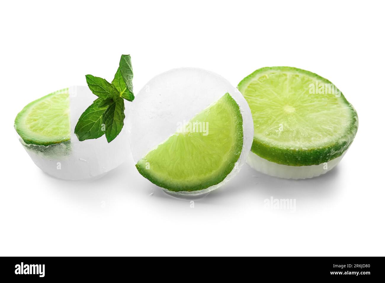 Slices of fresh lime frozen in ice on white background Stock Photo - Alamy