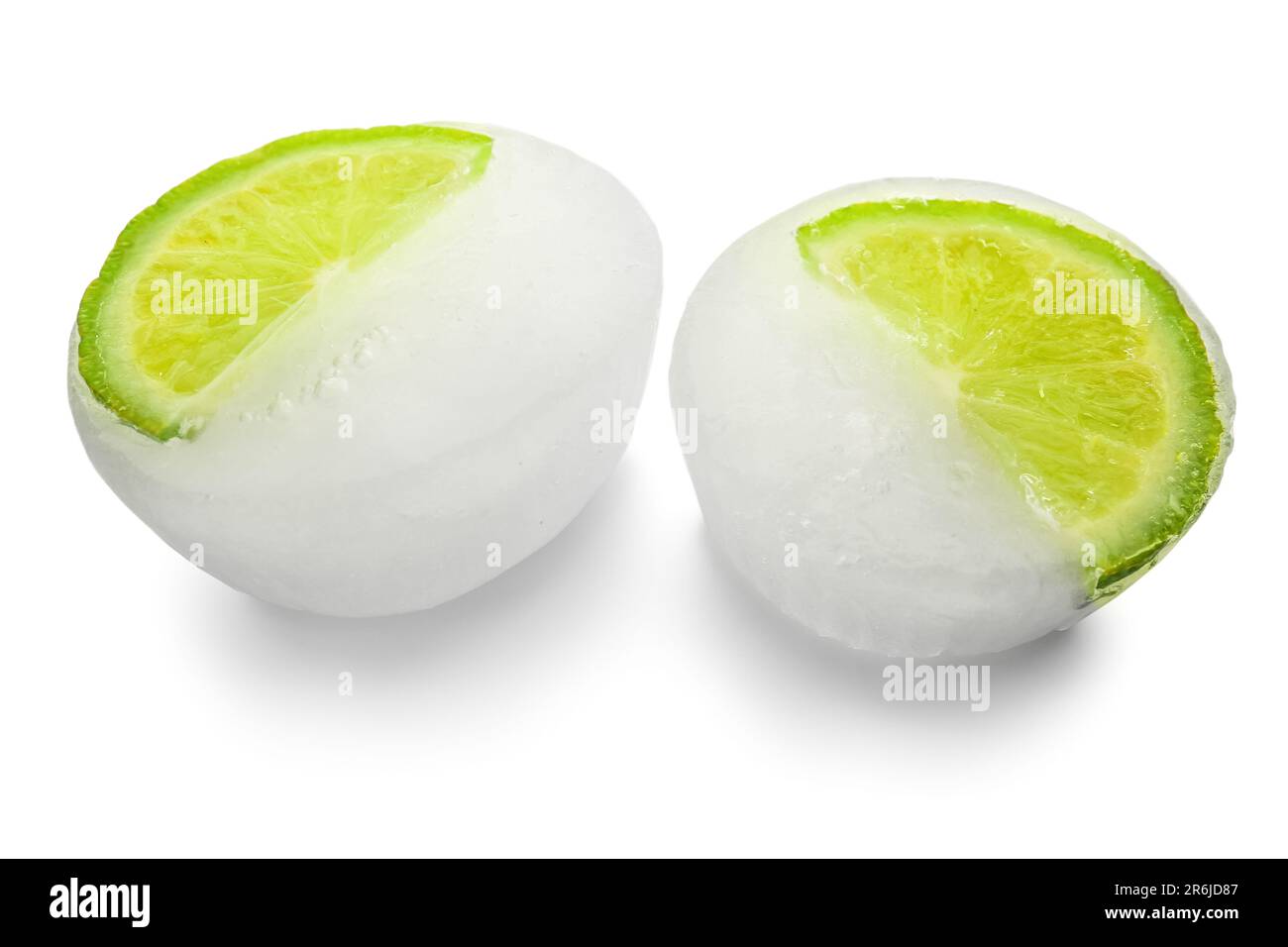 Slices of fresh lime frozen in ice on white background Stock Photo - Alamy