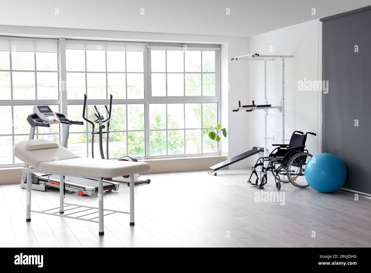 Interior of rehabilitation center with couch and equipment Stock Photo ...