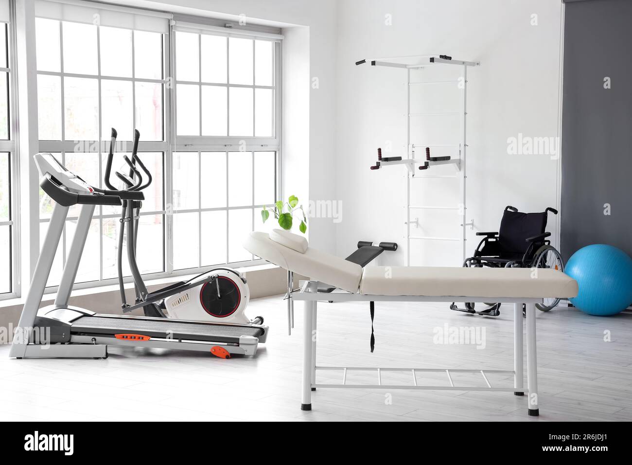 Interior of rehabilitation center with couch and equipment Stock Photo ...