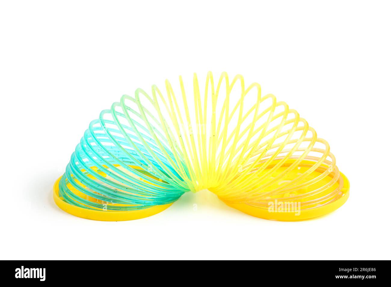 Colorful slinky isolated on white background. Children's Day ...