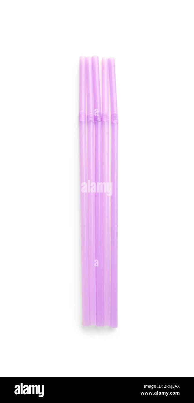 Purple plastic straws on white background Stock Photo - Alamy