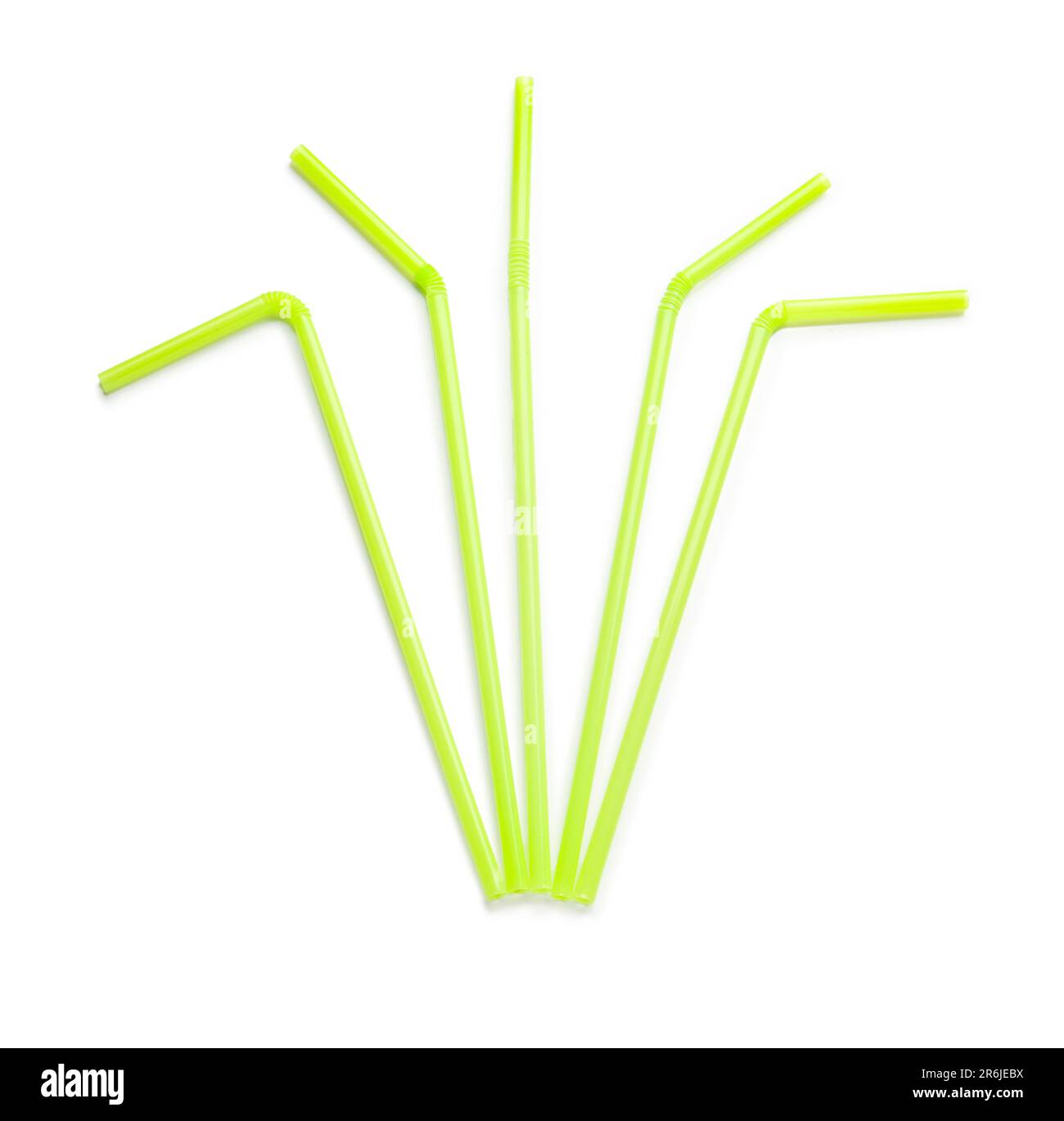 Green plastic straws on white background Stock Photo - Alamy