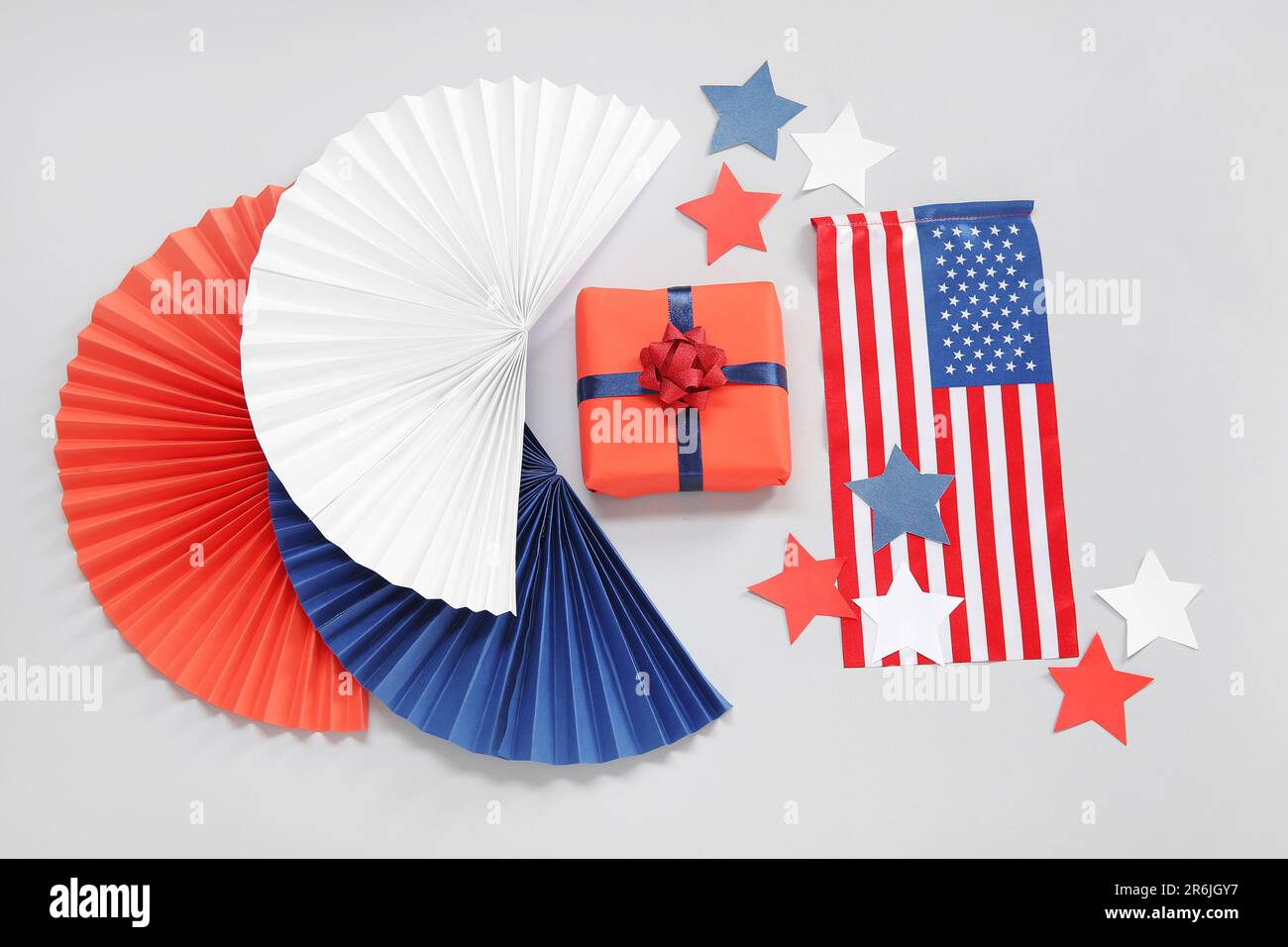 Gift box with colorful fans, USA flag and stars on grey background ...