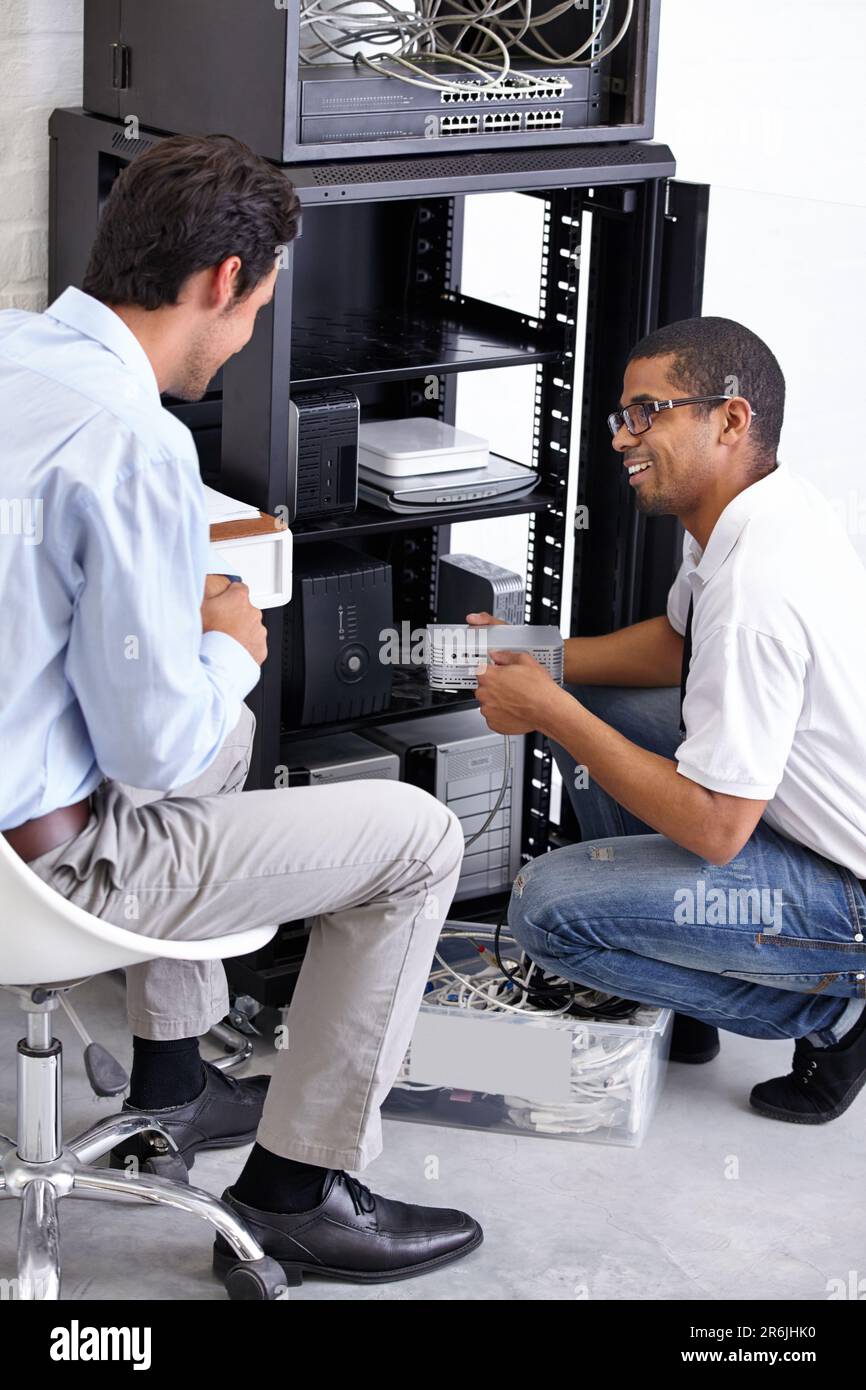 Server room, it support and maintenance with an engineer talking to a ...