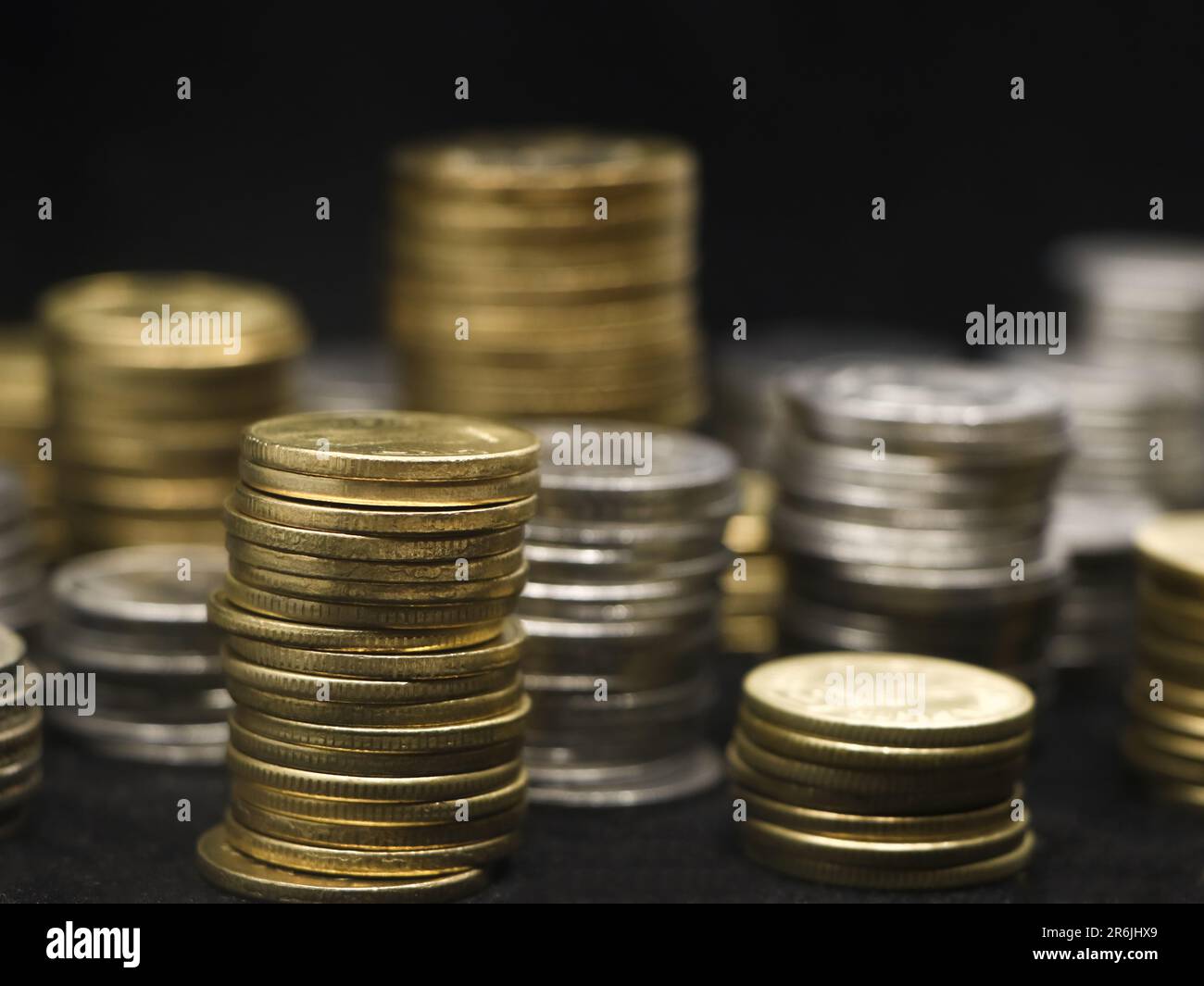 closeup shot of rows of gold and silver coins arranged and stacked in ...