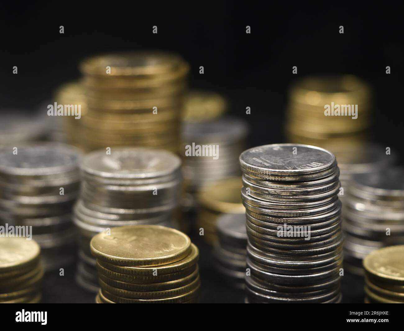 closeup shot of rows of gold and silver coins arranged and stacked in ...