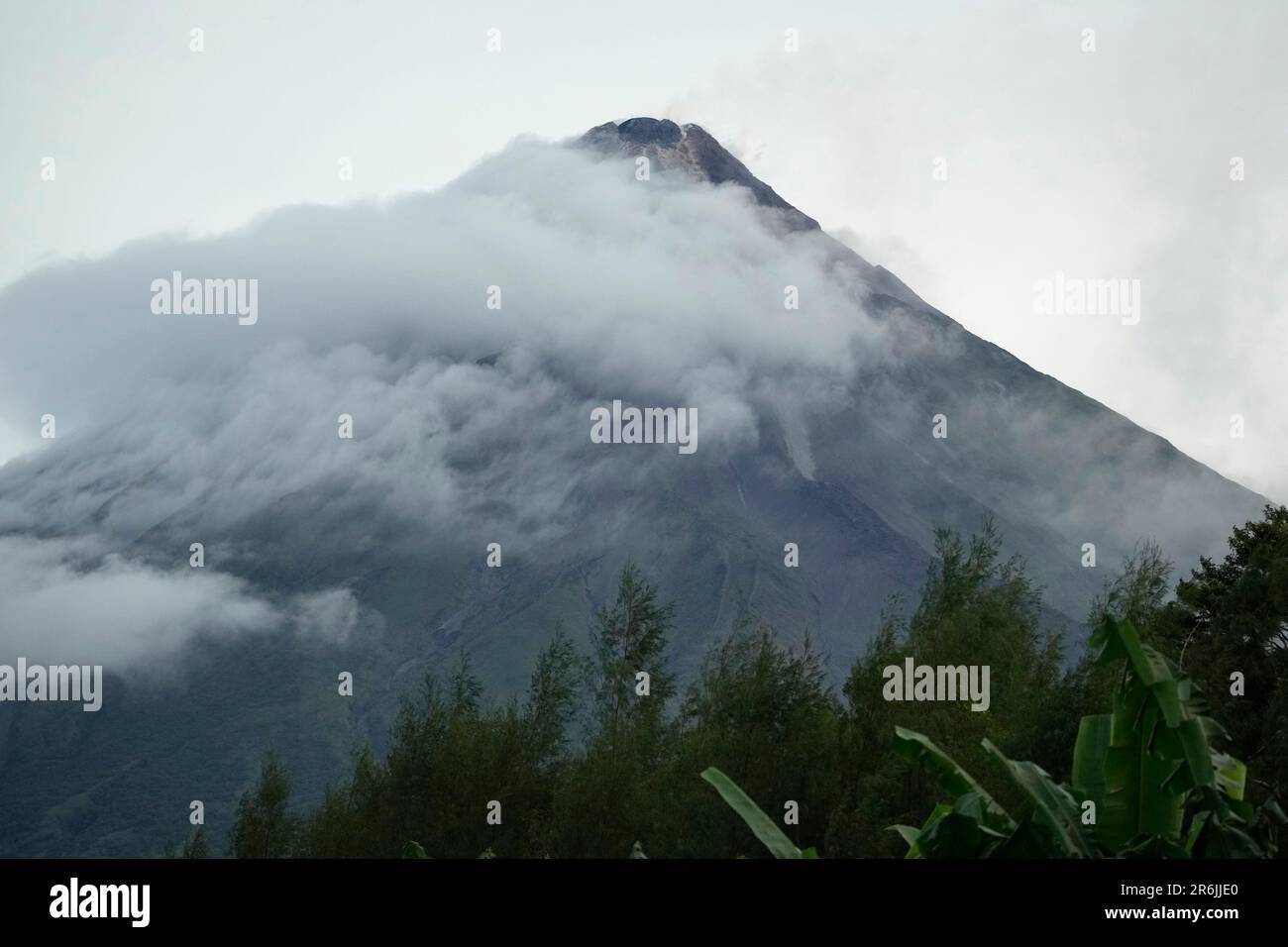The summit of the Mayon Volcano is seen from Bonga, Albay province ...