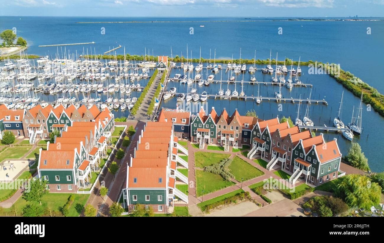 Aerial drone view of typical modern Dutch houses and marina in harbor ...
