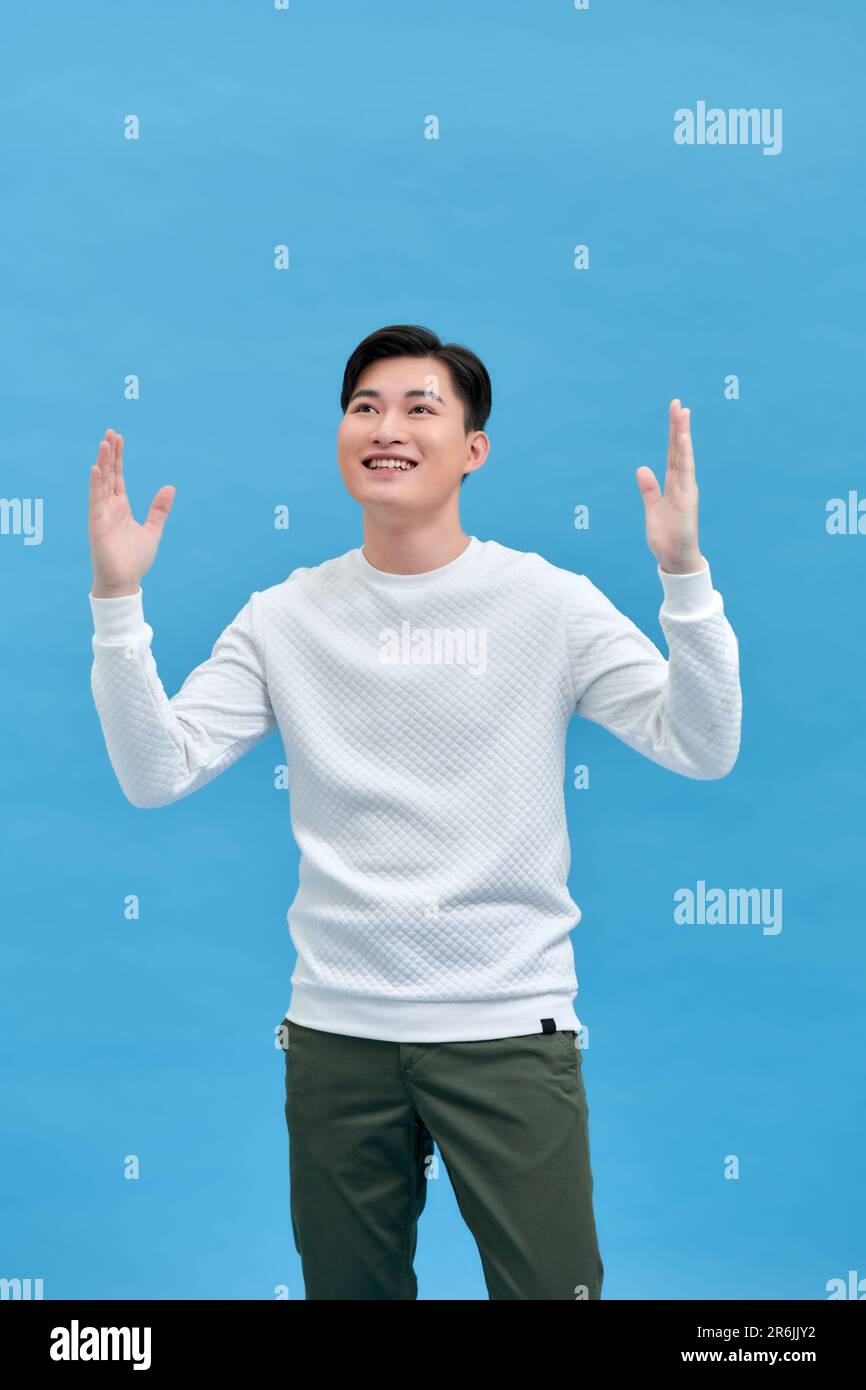 Happy guy rejoicing and clenching fists like winner or lucky person ...