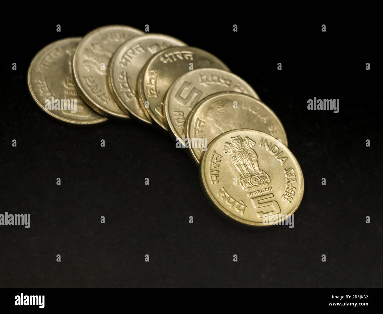 antique indian gold 5 (five) rupee coins arranged in a row shaped like ...