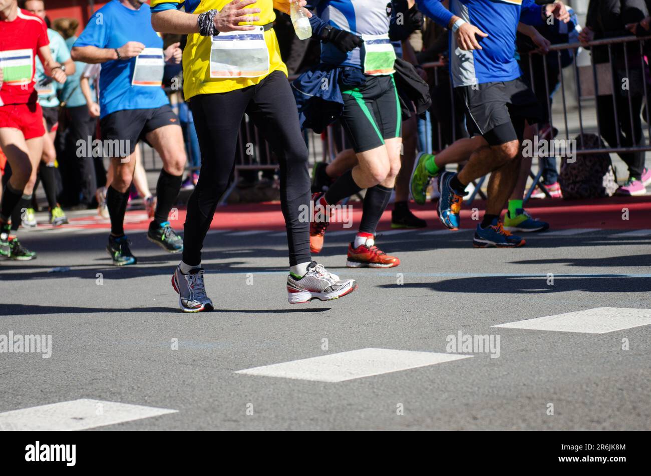 Marathon running race, many runners feet on road racing, sport ...