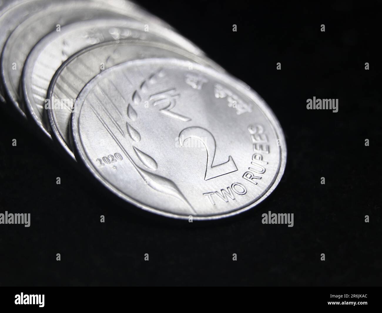 closeup macro shot of new mint 2 or two rupee silver coins of india in ...