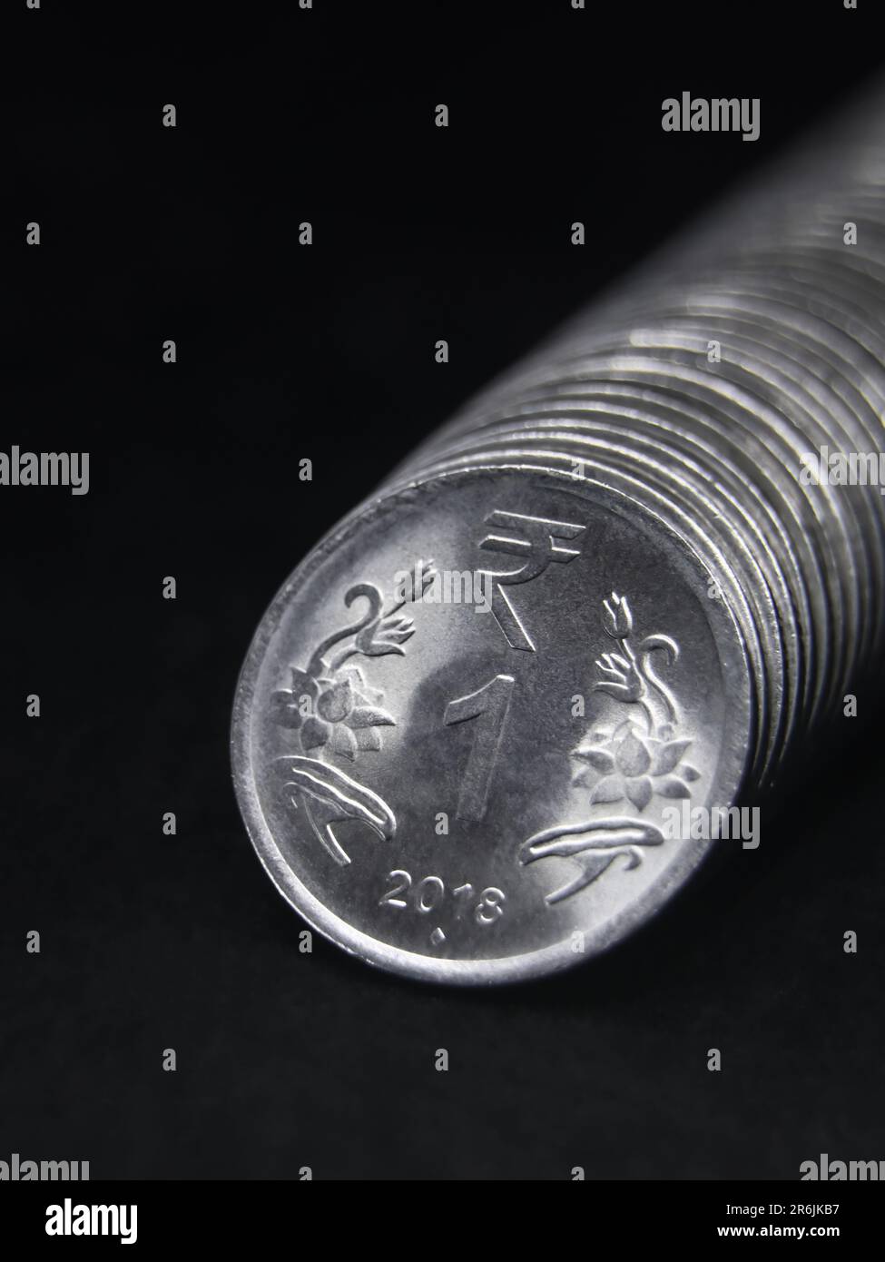 closeup shot of shiny silver one or 1 rupee coin of india arranged in a ...