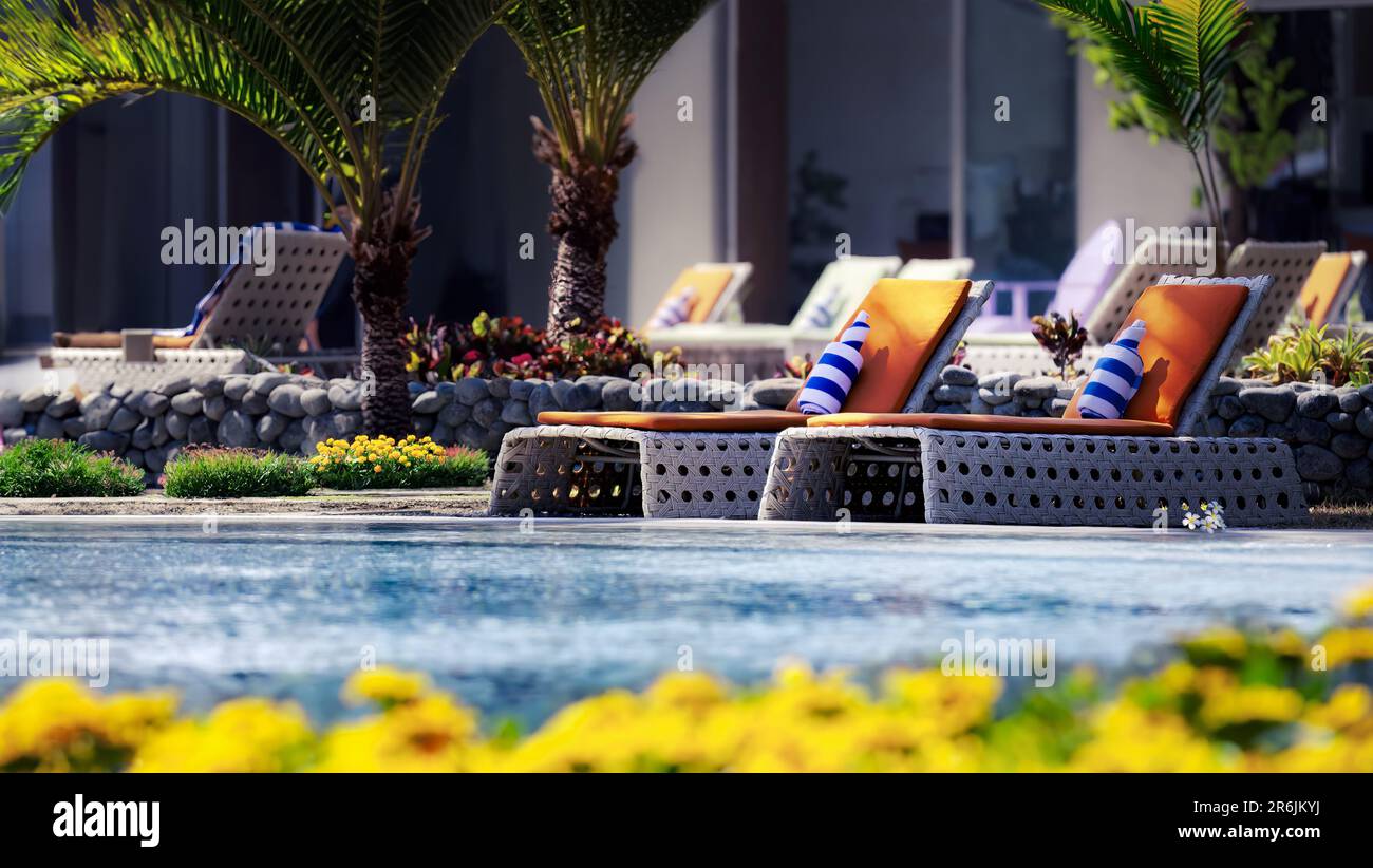 Sun Loungers at a Swimming Pool Inside a Luxury Sub-Tropical Resort ...