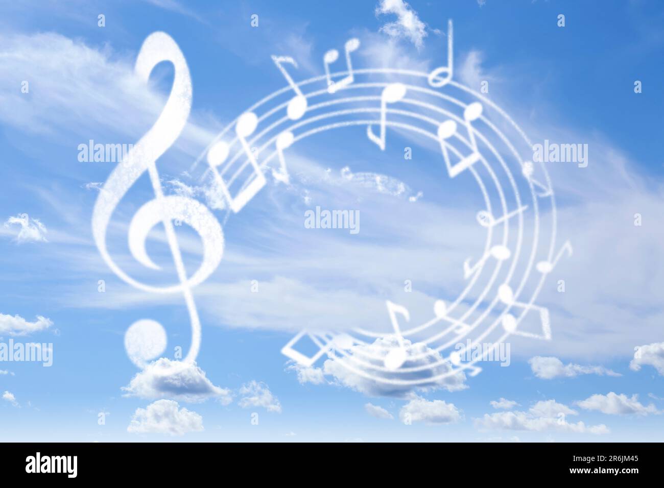 Treble clef and swirly staff with musical notes against sky Stock Photo ...