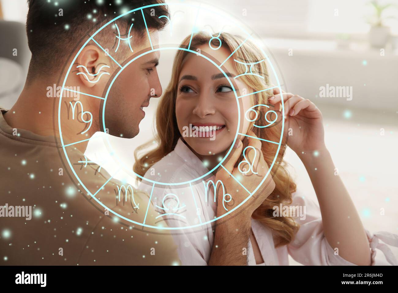Horoscope compatibility. Loving couple indoors and zodiac wheel Stock ...