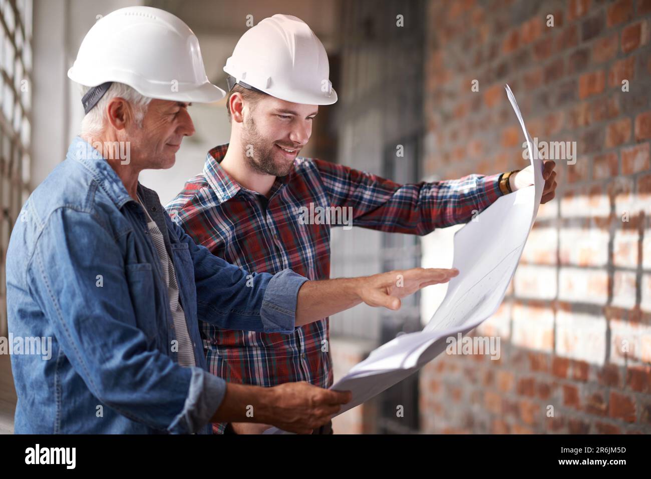 Architect team, blueprint and engineer reading for planning, analysis ...