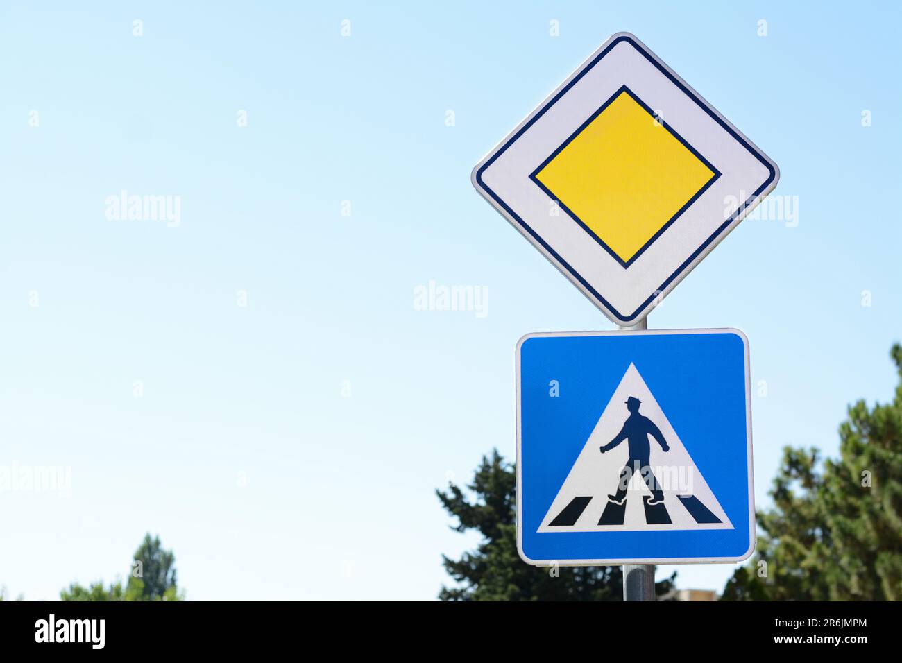 Pedestrian Crossing and Priority road signs outdoors. Space for text ...
