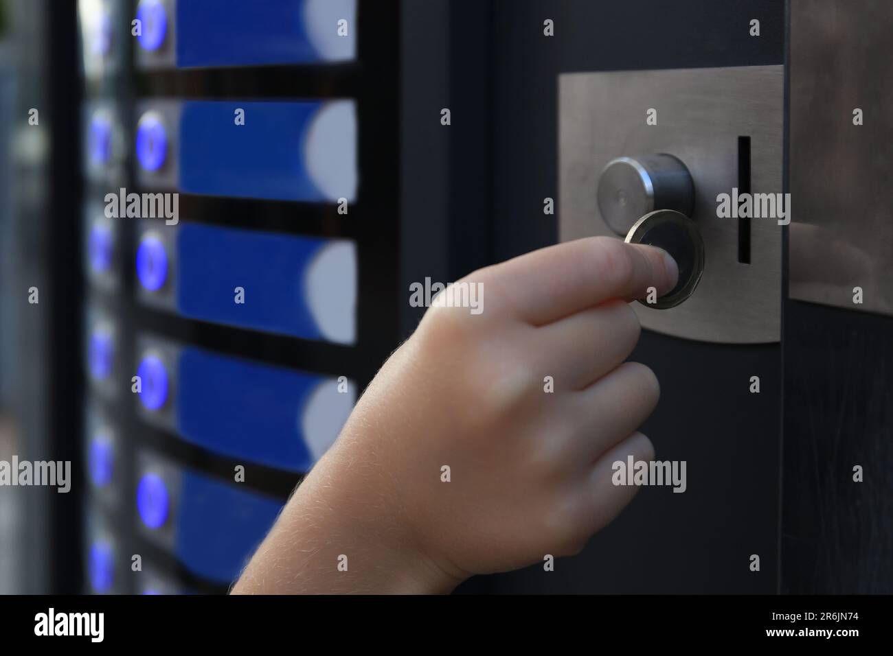 Using coffee vending machine. Girl inserting coin into acceptor ...