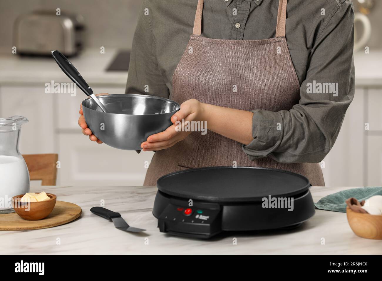 Woman cooking crepes in hi-res stock photography and images - Alamy