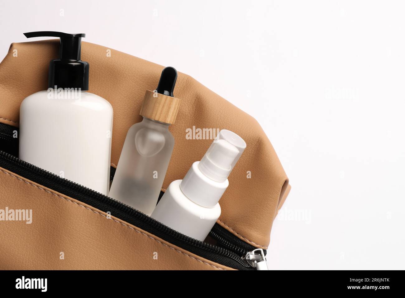 Preparation for spa. Compact toiletry bag with cosmetic products on ...