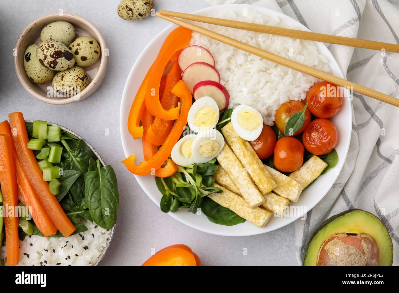 Delicious poke bowl and ingredients on light grey background, flat lay ...