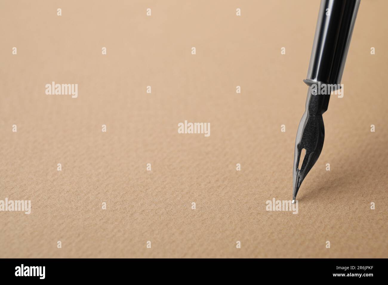 Writing on sheet of paper with fountain pen, closeup. Space for text ...