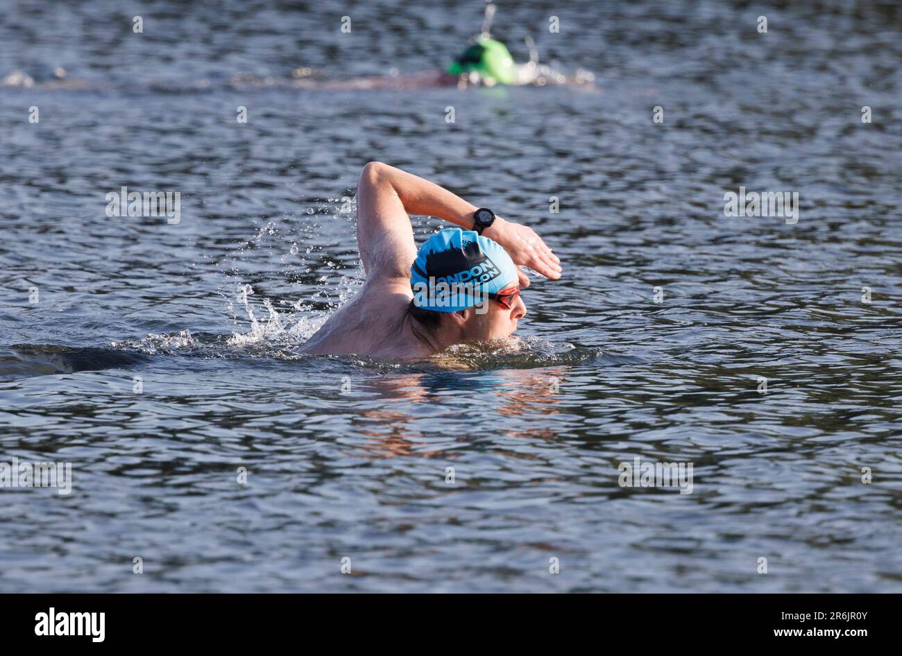 London, UK. 10th June, 2023. A man takes an early morning dip in the ...