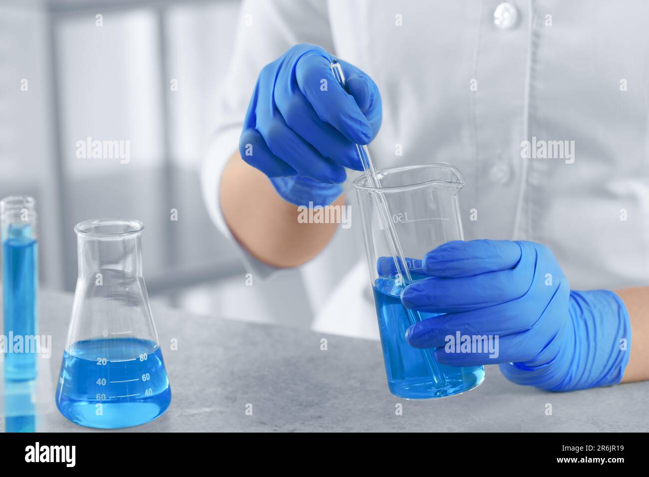 Scientist taking sample blue liquid hi-res stock photography and images ...