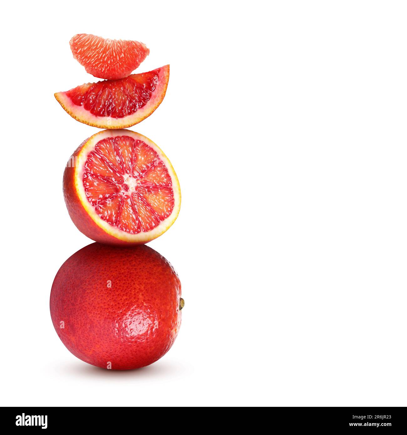 Stacked cut and whole red oranges on white background Stock Photo - Alamy
