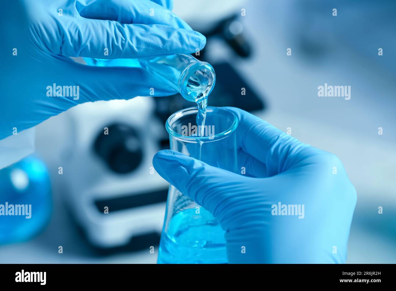 Woman working flasks in laboratory hi-res stock photography and images ...