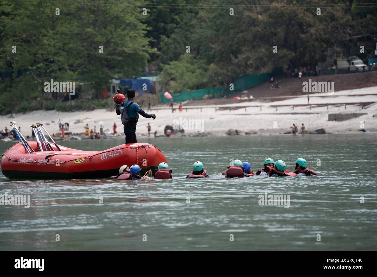 group of people, friends, family floating in blue green cool water of ...