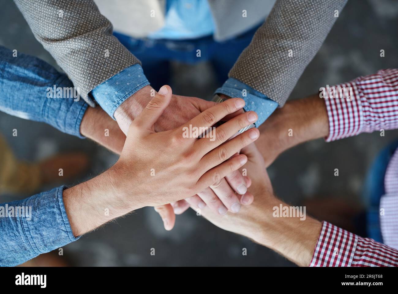 Teamwork, top view and hands together for cooperation, team building or solidarity ...