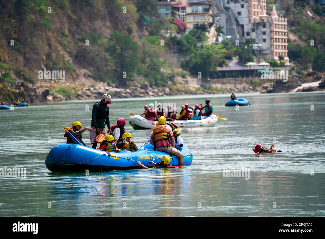 group of people, friends, family floating in blue green cool water of ...