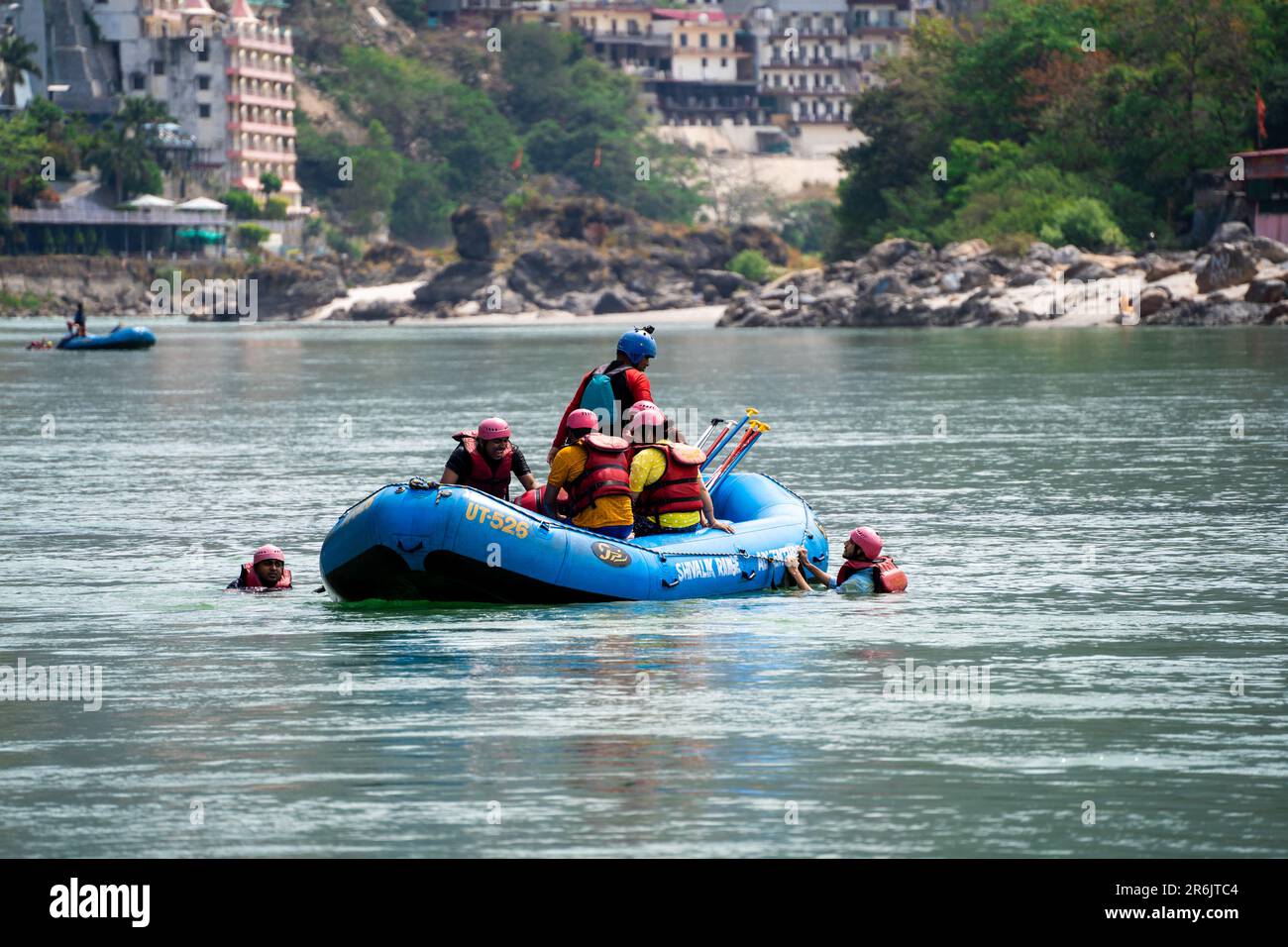 group of people, friends, family floating in blue green cool water of ...