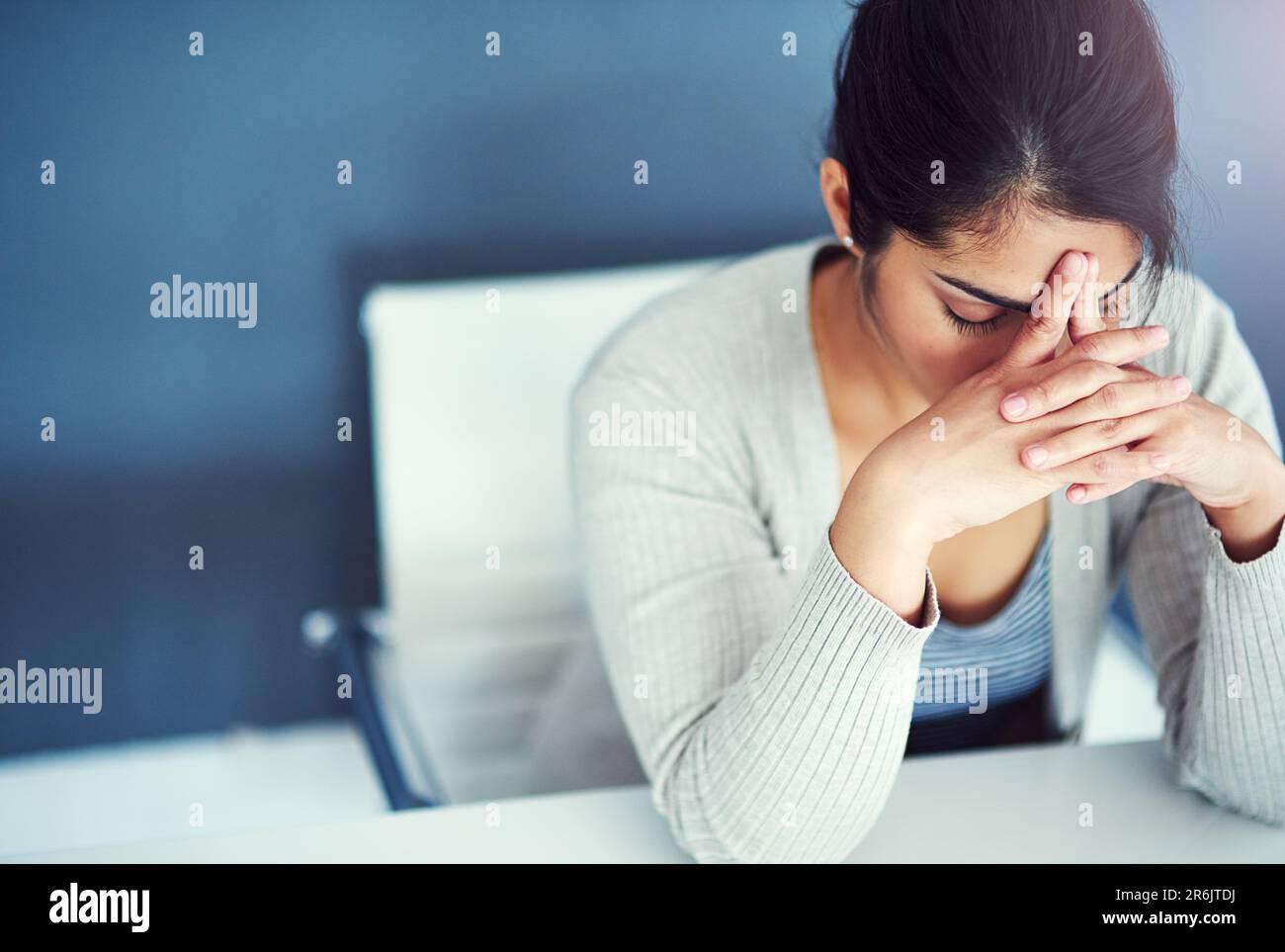 Business woman, stress and tired in office with hands, worried and ...