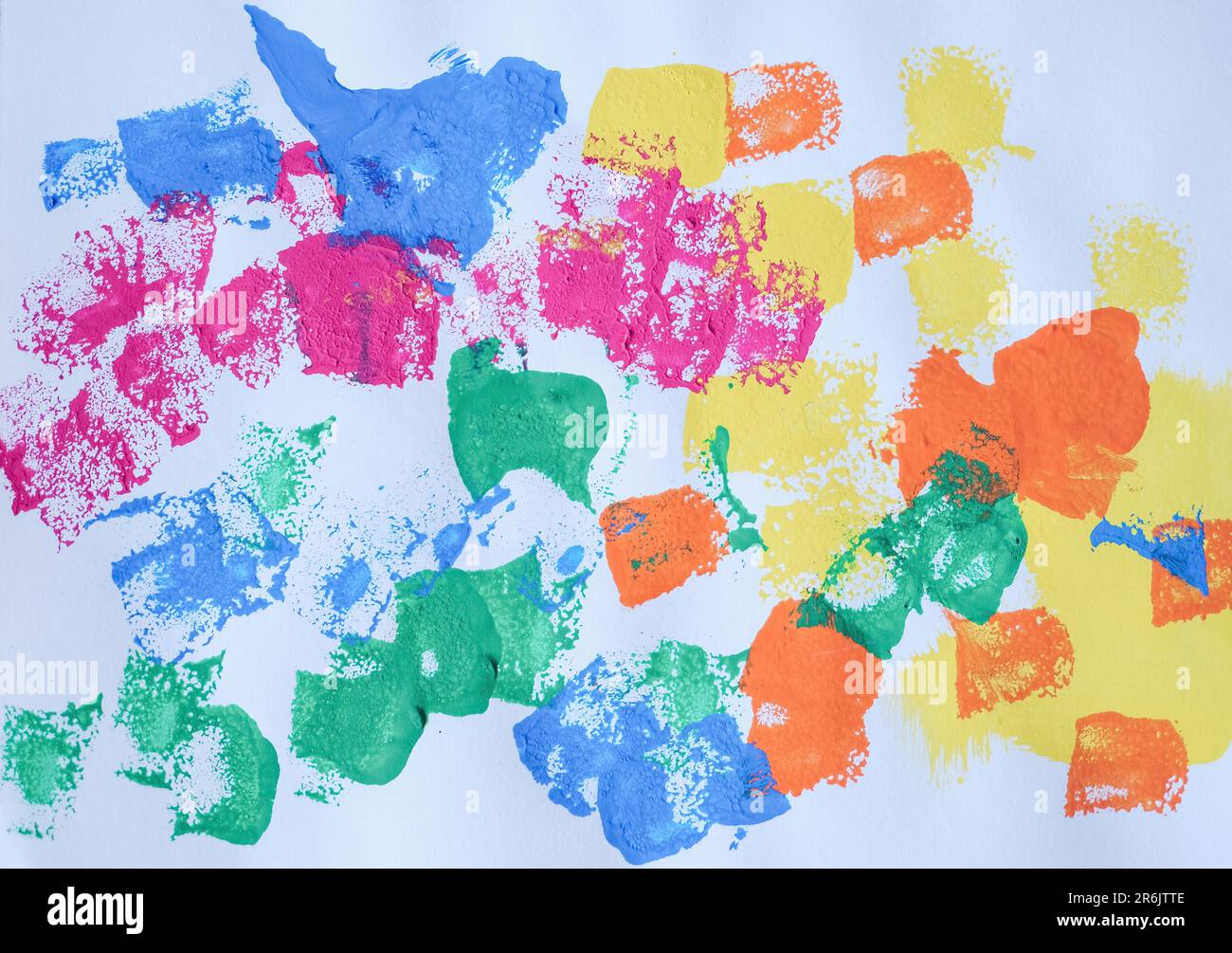 Abstract kids drawing with colorful paints on a white sheet of paper ...