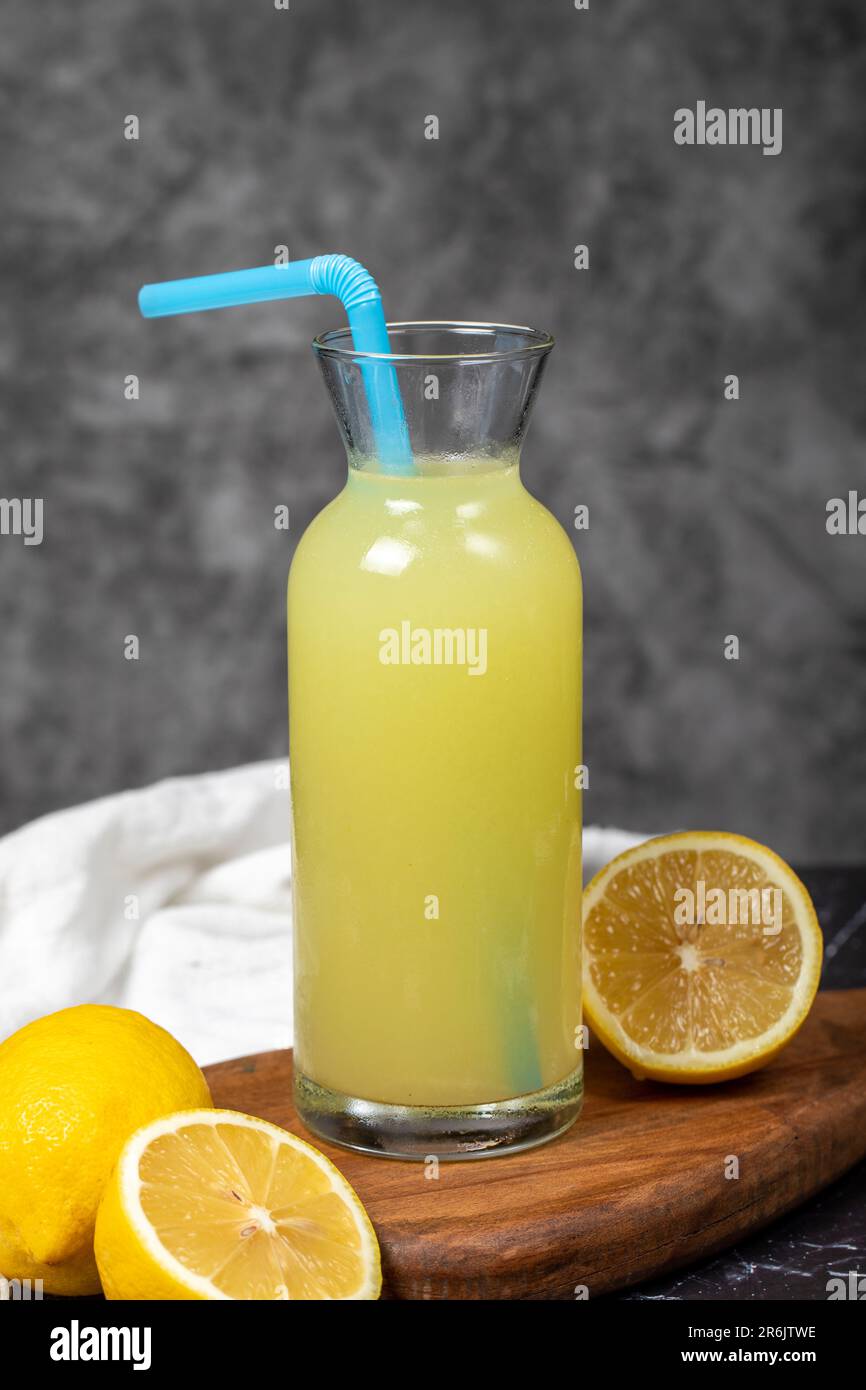 Homemade lemonade. Cool freshly made lemonade and fruits on dark ...