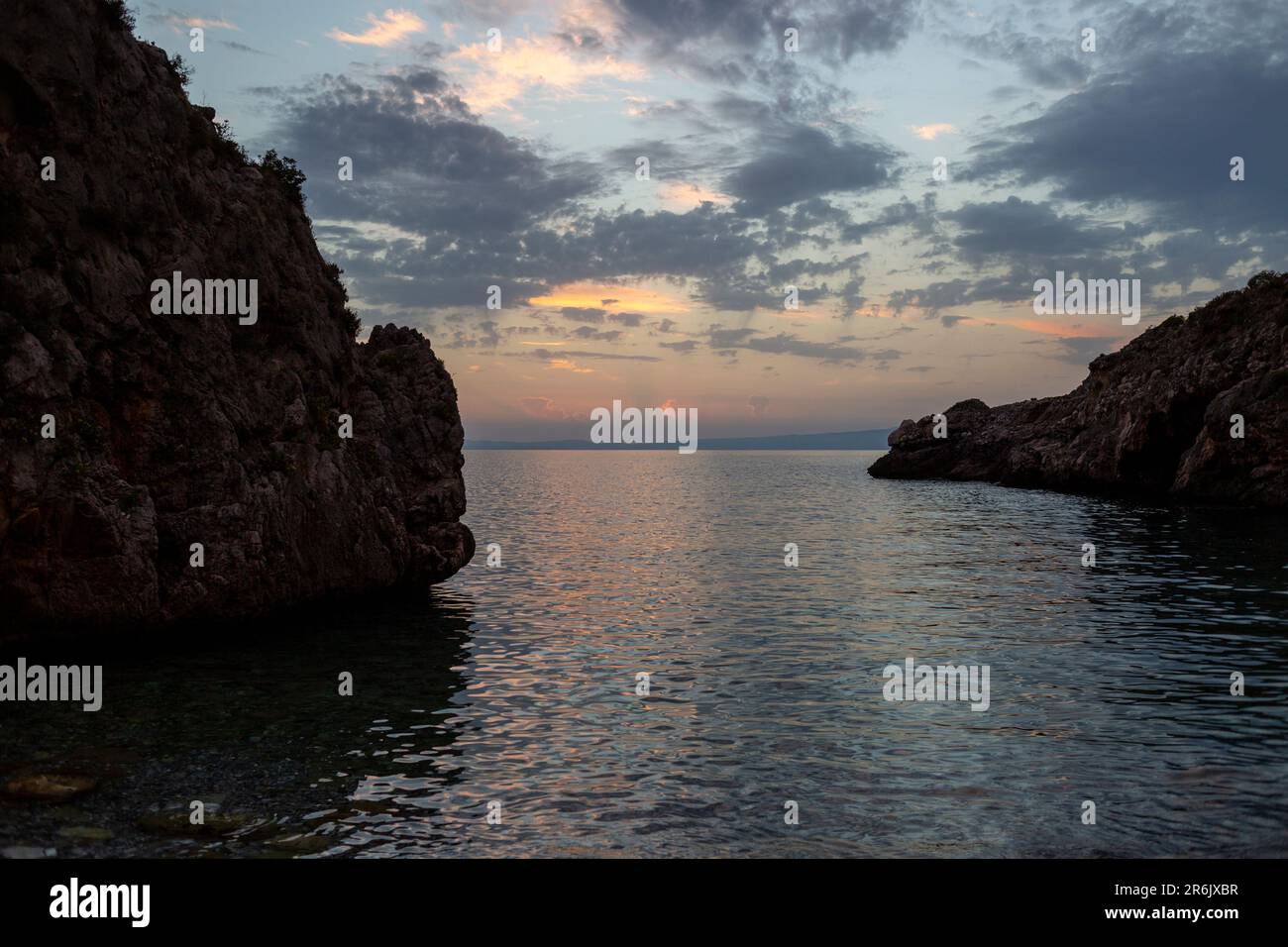 Sunset over rocky coastline hi-res stock photography and images - Alamy