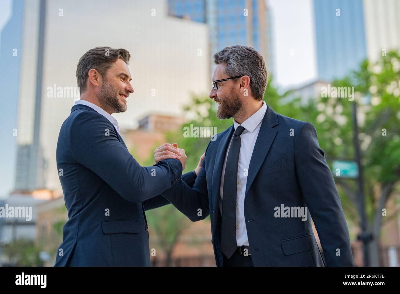 The two business team worked together to achieve their goals. Business ...