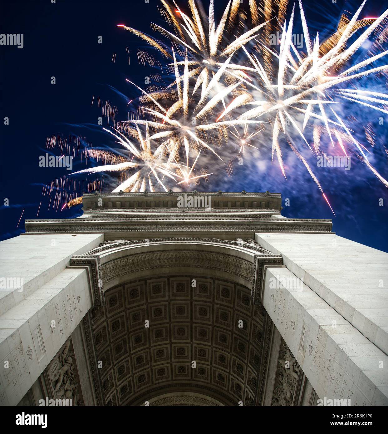Celebratory colorful fireworks over the Arc de Triomphe, Paris, France ...