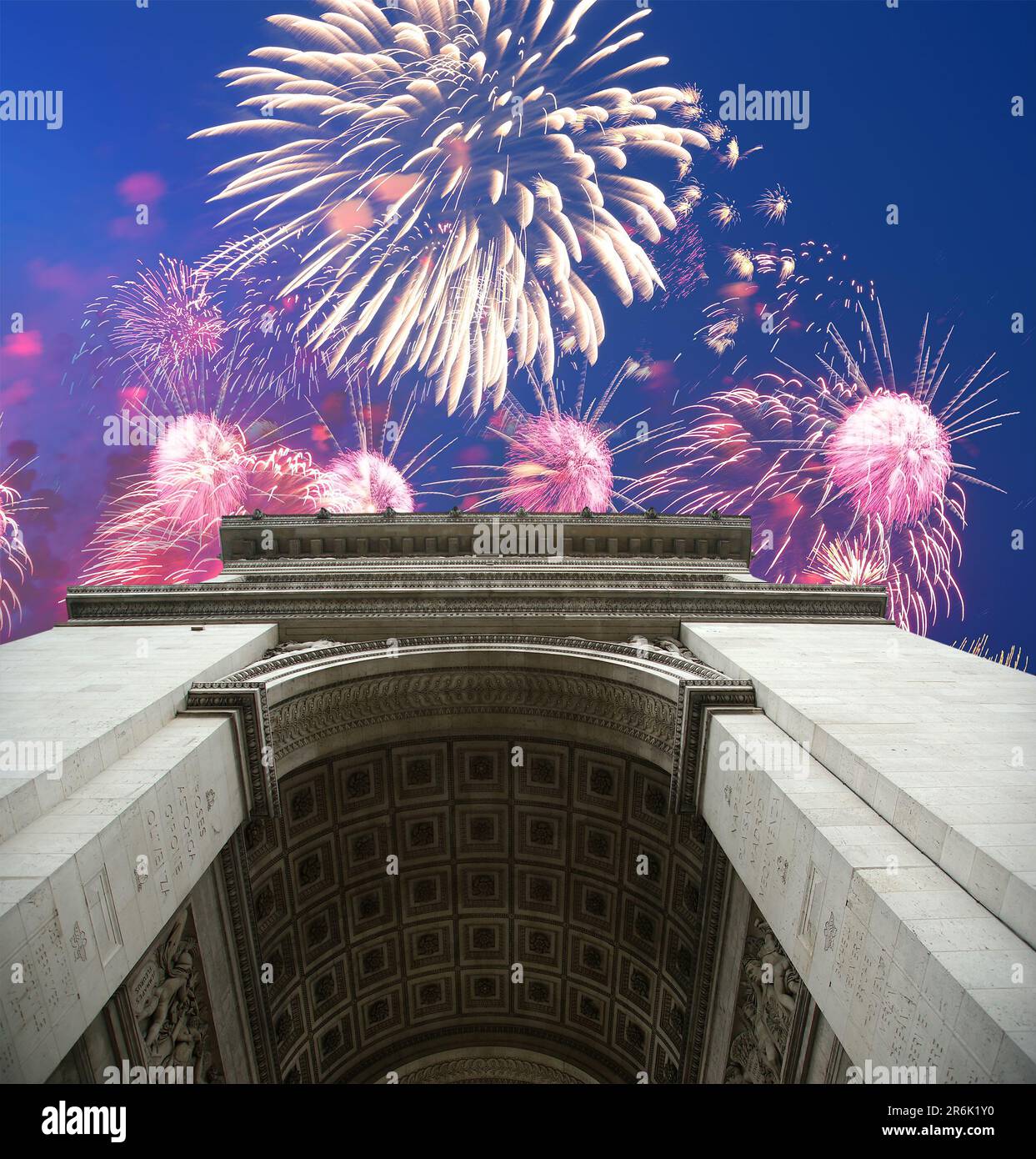 Celebratory colorful fireworks over the Arc de Triomphe, Paris, France ...