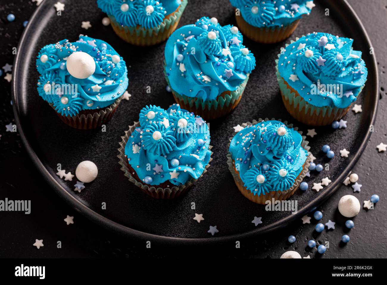 Beautiful and unique cupcakes with flower shaped cream. Perfect blue ...