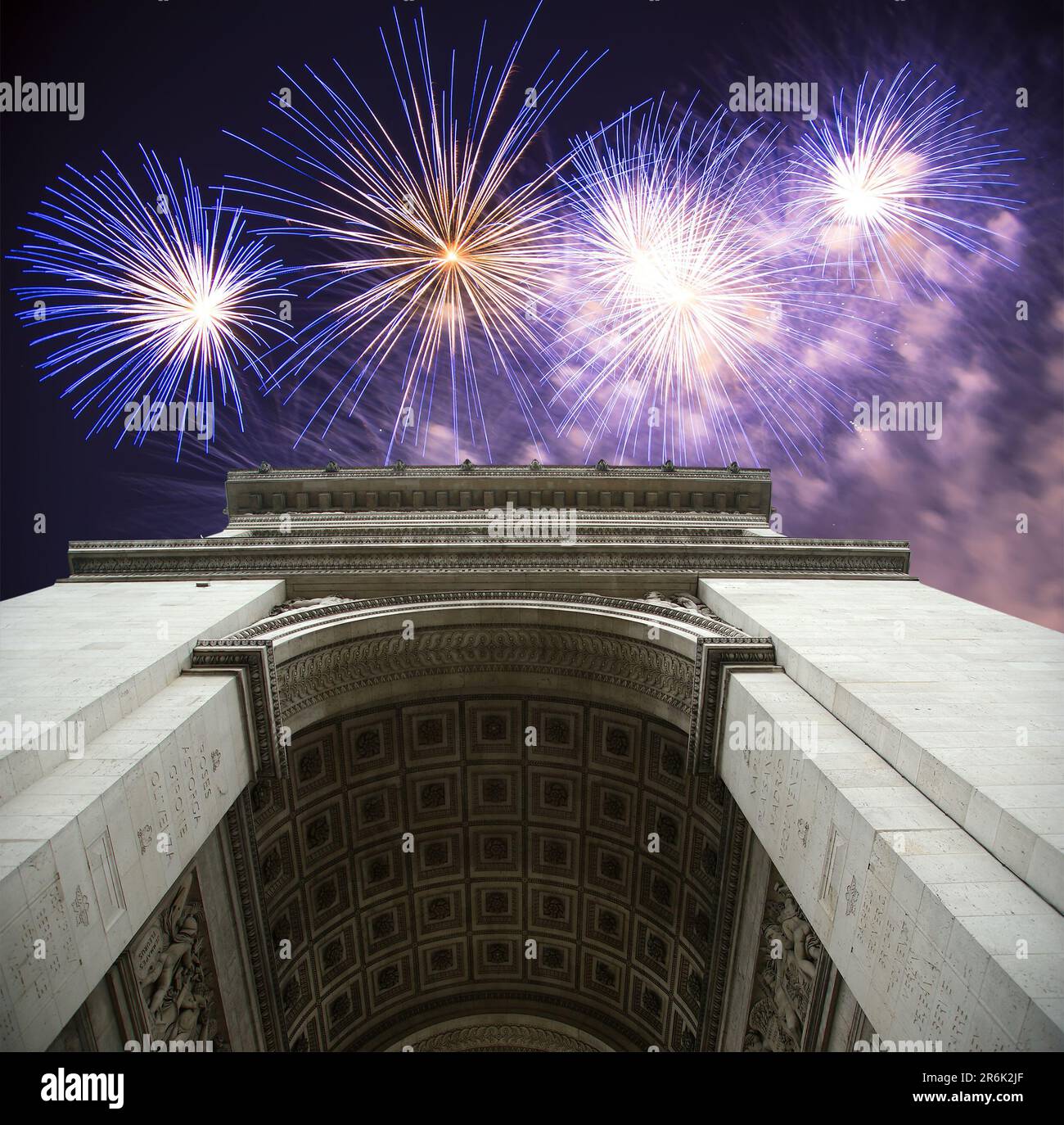 Celebratory colorful fireworks over the Arc de Triomphe, Paris, France ...