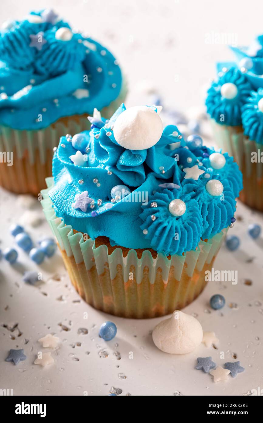 Tasty and sweet cupcakes for fat thursday. Perfect blue dessert with ...