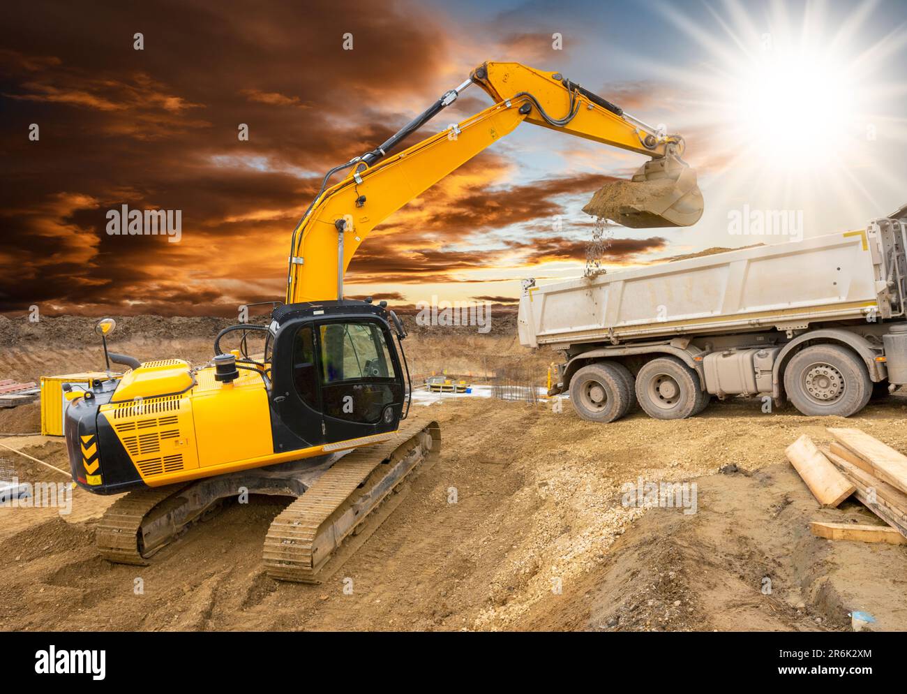 excavator is working and digging at construction site Stock Photo - Alamy