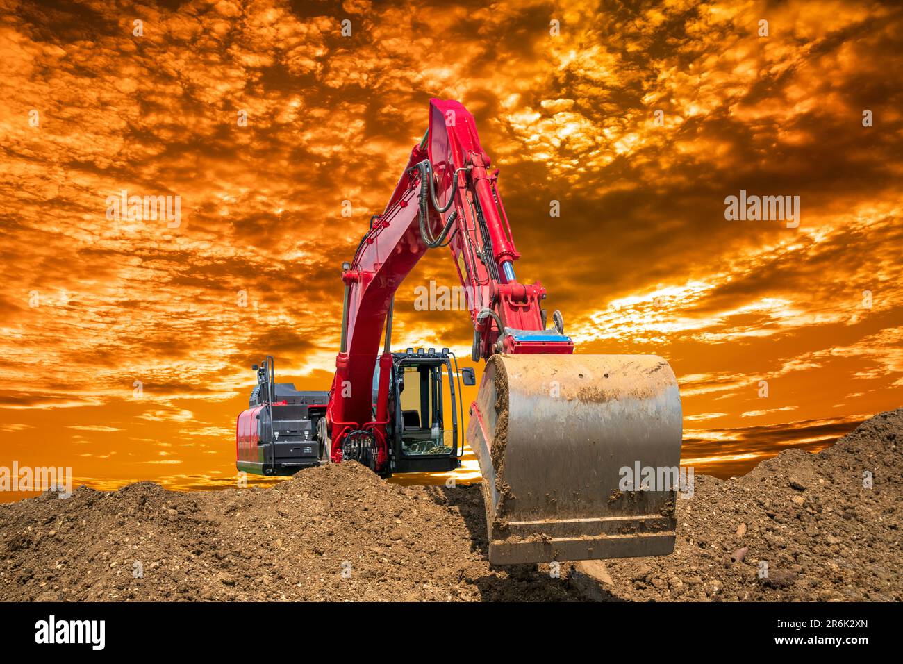 excavator is working and digging at construction site Stock Photo - Alamy
