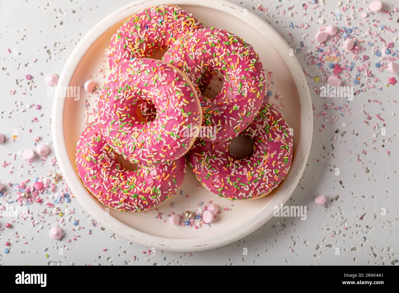 Fresh and yummy pink donuts topped with sprinkles. Donuts is most ...